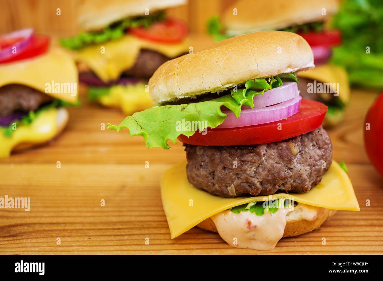 Delicious handmade burger on wooden background Stock Photo - Alamy