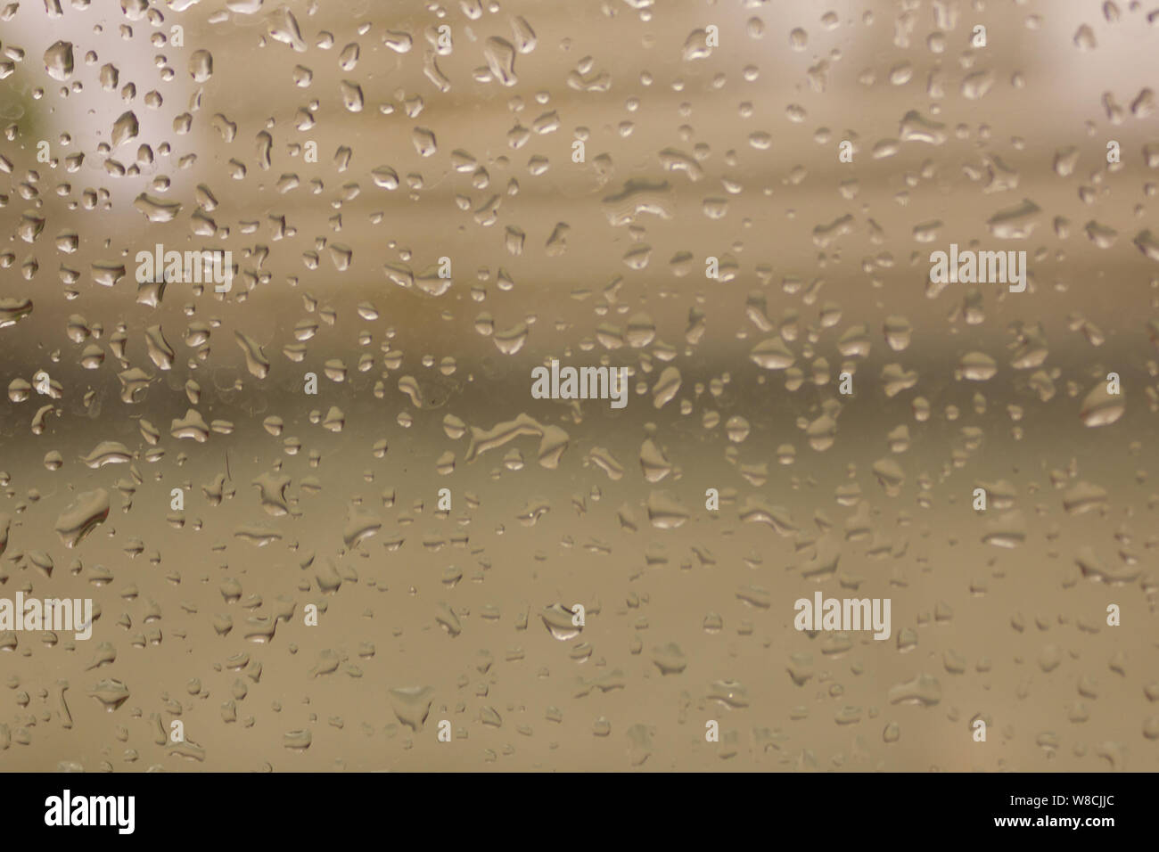 Rain Drops On Surface of wet Window Glass pane In Rainy Season ...