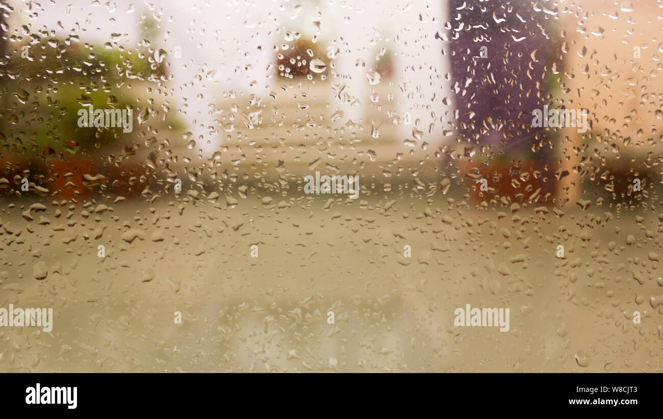 Rain Drops On Surface of wet Window Glass pane In Rainy Season ...