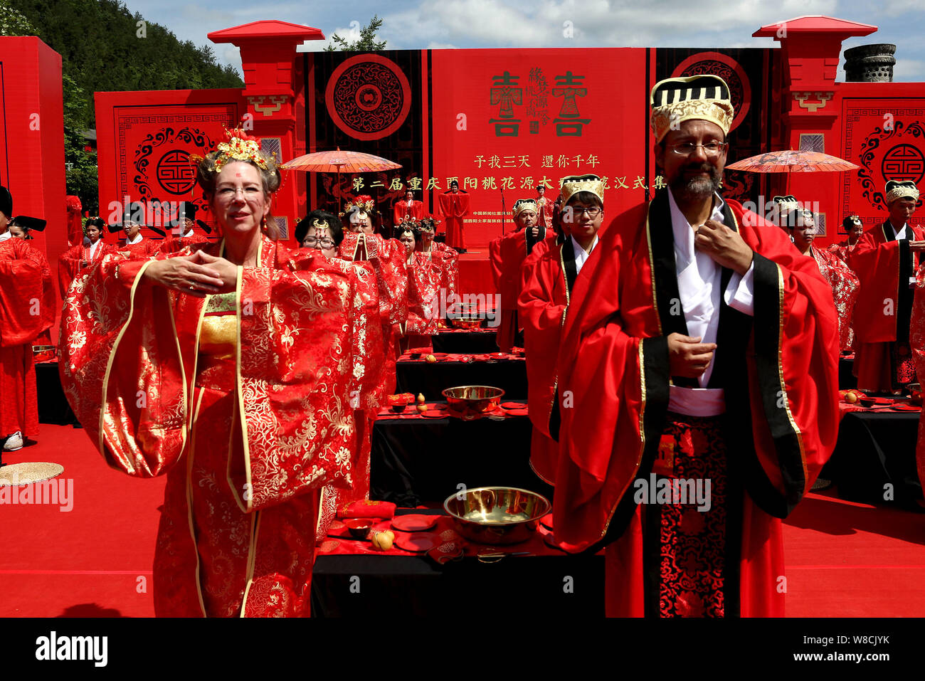 Couples of Chinese and foreign newlyweds dressed in Chinese Han ...