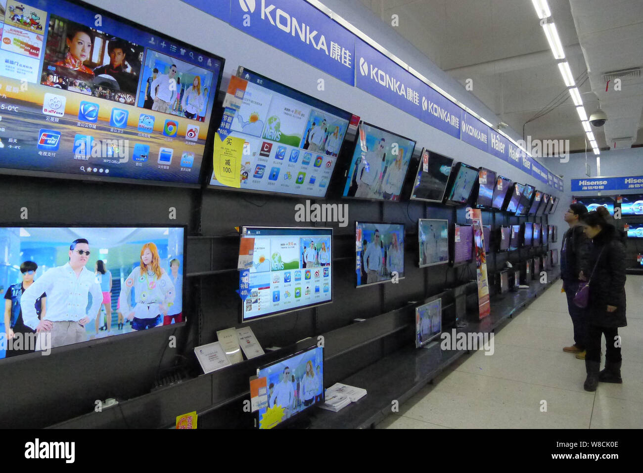--FILE--Customers shop for Konka LED televisions at a home appliances ...