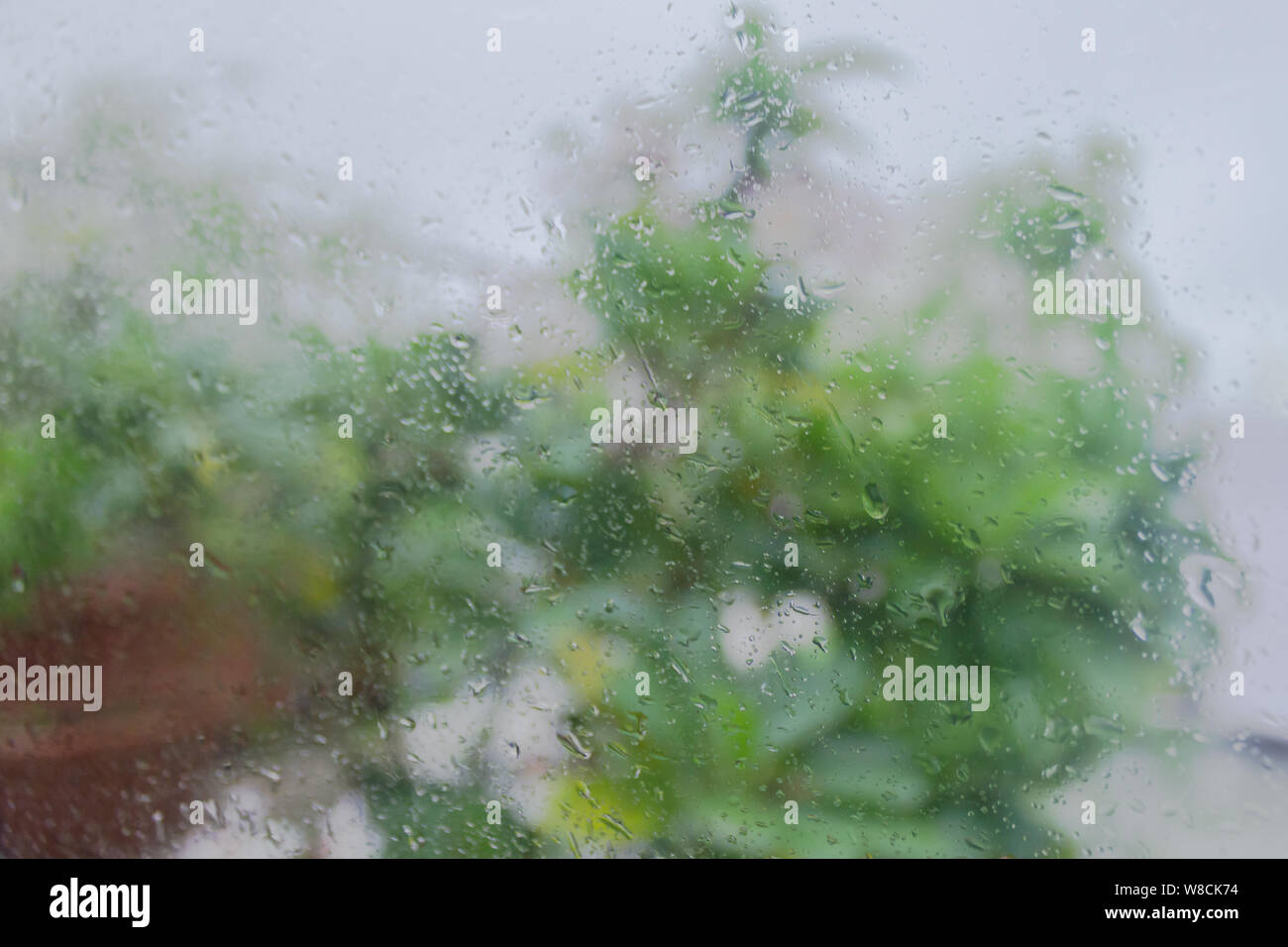 Rain Drops On Surface of wet Window Glass pane In Rainy Season ...
