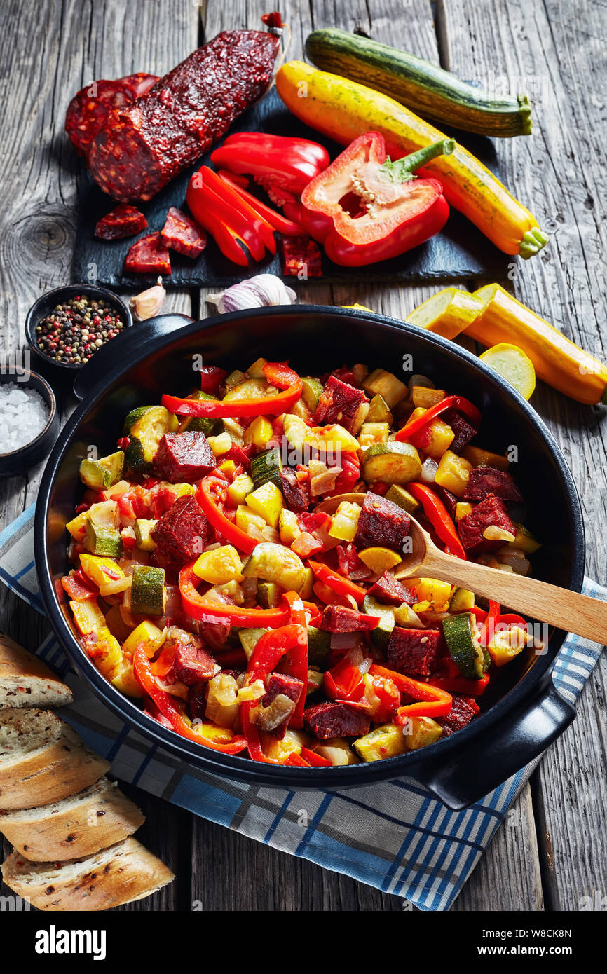 Spanish Pisto manchego - vegetable stew with fried chorizo sausages in ...