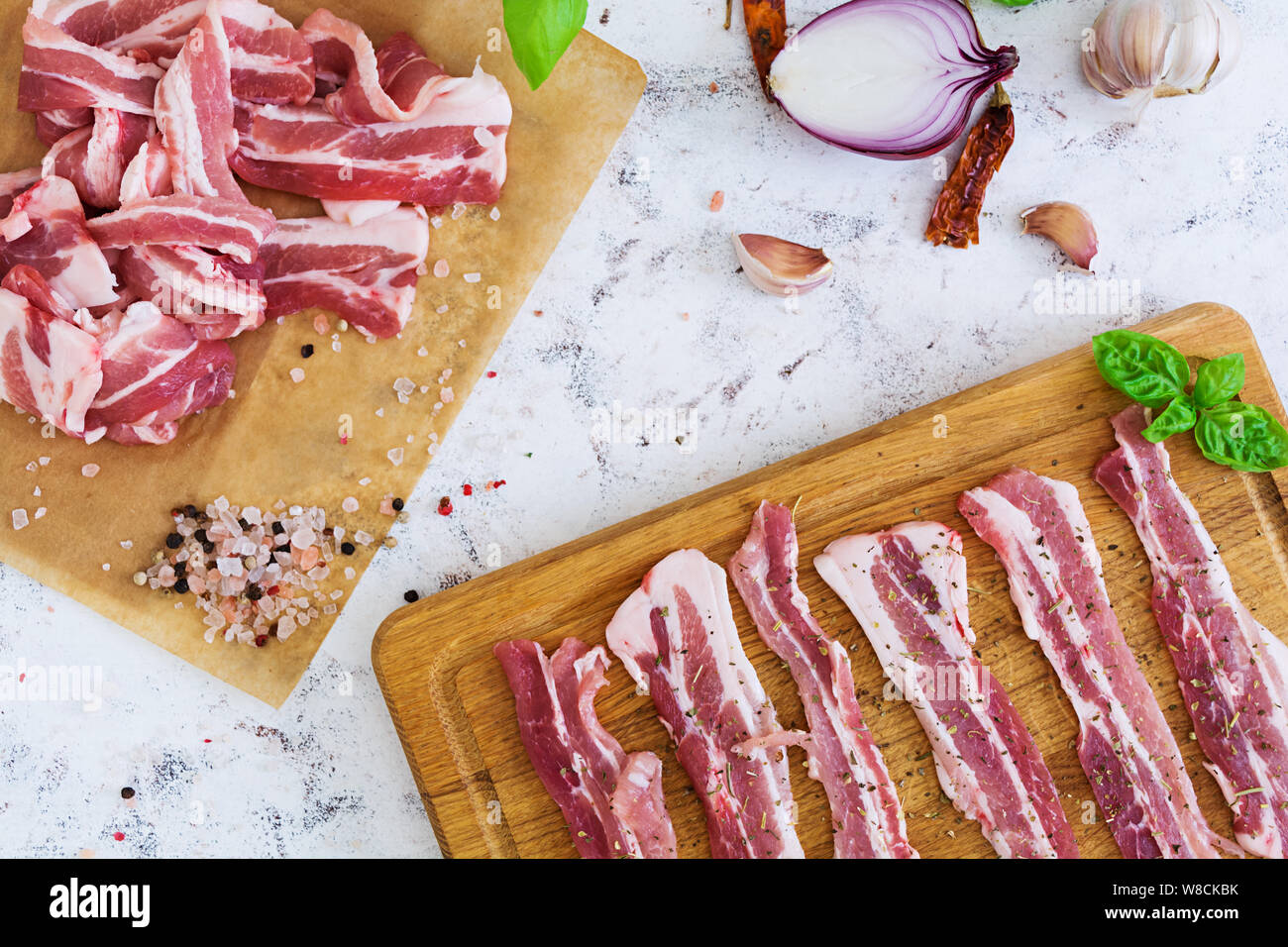 Fresh sliced bacon with spices on white background Stock Photo - Alamy