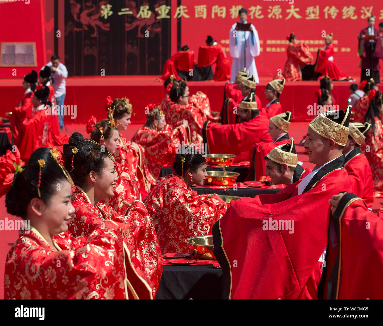 Couples of Chinese and foreign newlyweds dressed in Chinese Han ...
