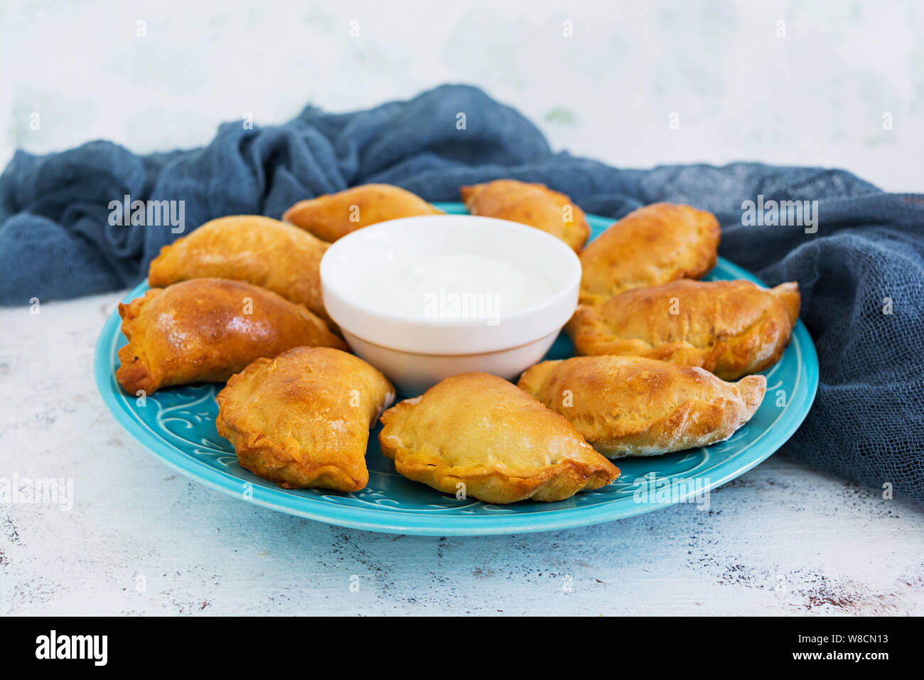 Baked dumplings on white background Stock Photo - Alamy