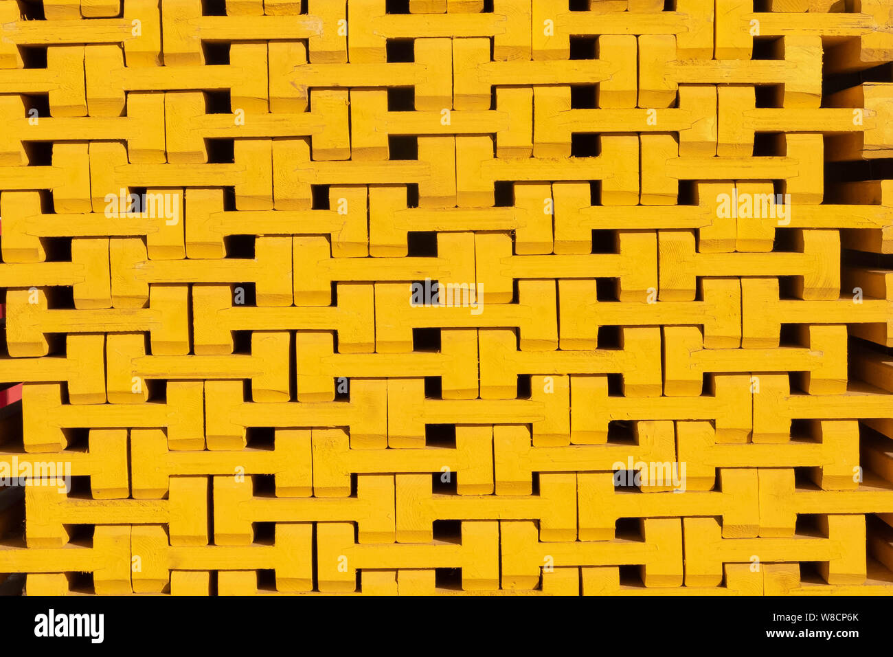 Yellow wooden piled formwork beams. Construction equipment Stock Photo ...