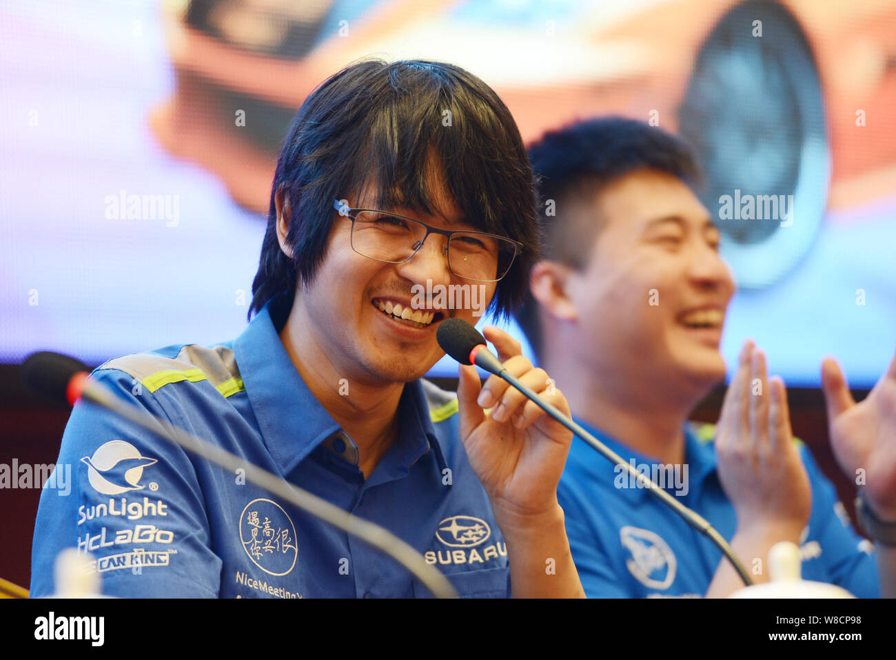 Chinese writer and racer Han Han reacts during a press conference for ...