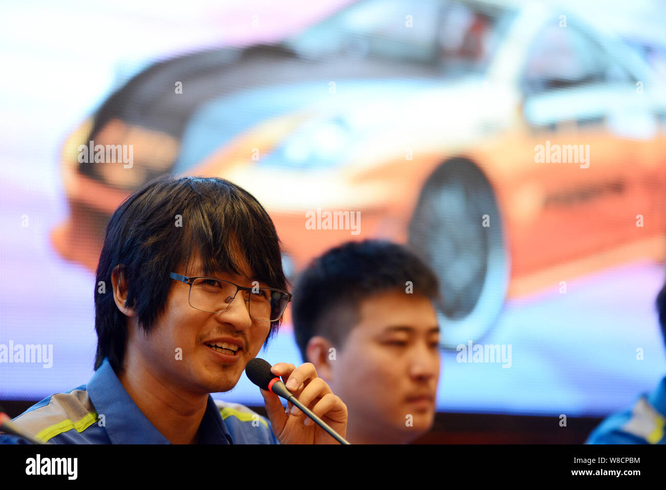 Chinese writer and racer Han Han speaks during a press conference for ...