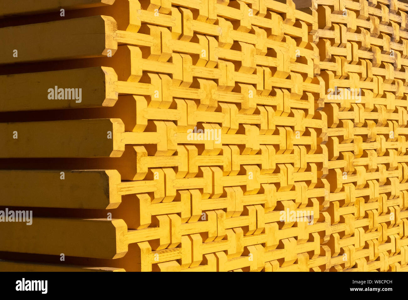 Yellow wooden piled formwork beams. Construction equipment Stock Photo ...
