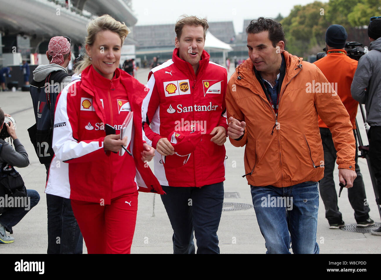 German F1 driver Sebastian Vettel of Ferrari, center, arrives at the ...