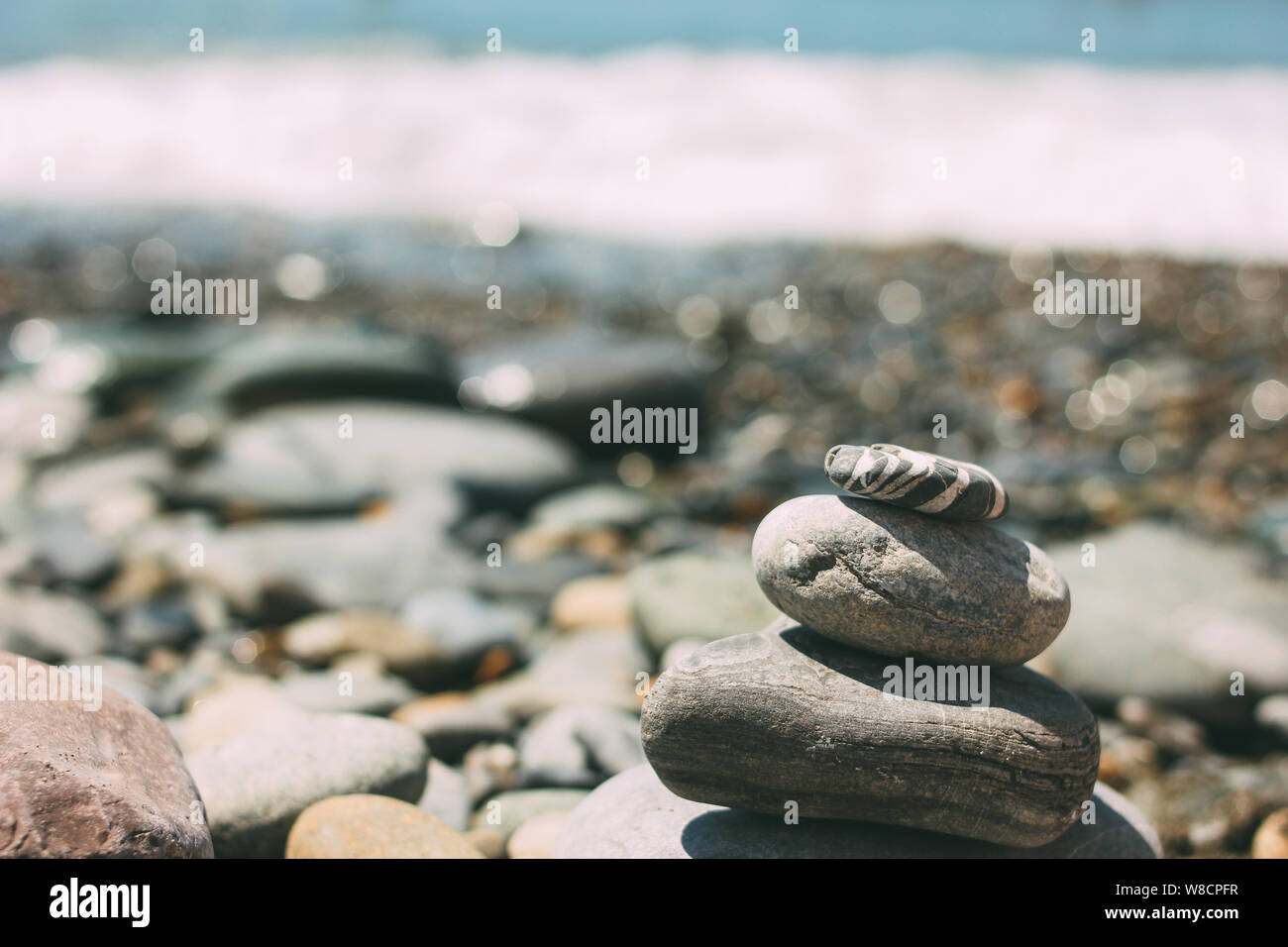 Pile of pebbles stones on the blurred sea beach background Stock Photo ...