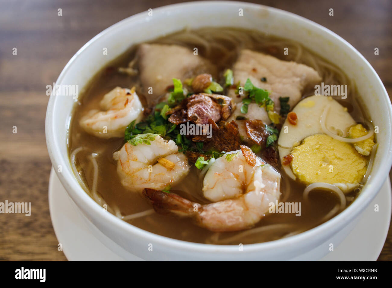 Prawn and fish in indonesian spicy soup rice noodle called soto Stock ...
