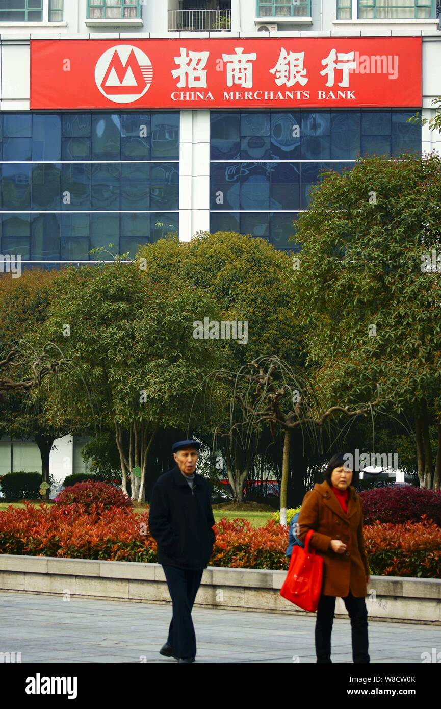 --FILE--Pedestrians walk past a branch of China Merchants Bank (CMB) in ...