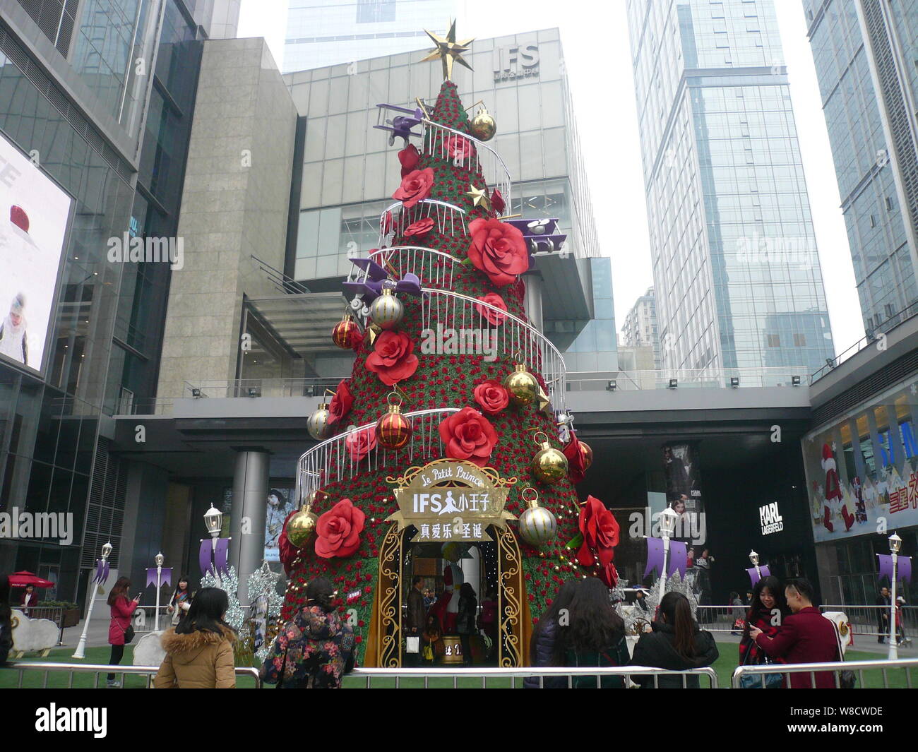 --FILE--Pedestrians look at a Christmas tree in front of the IFS ...