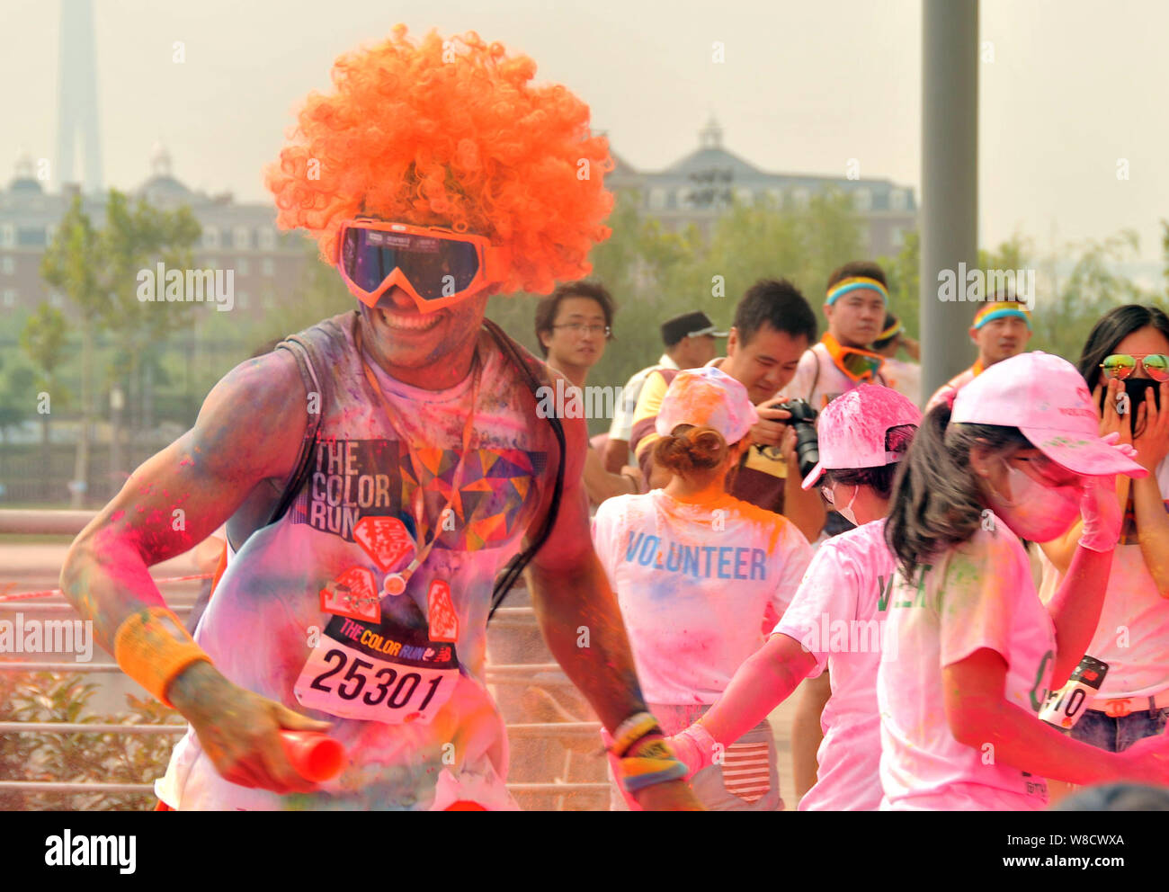 --FILE--Participants take part in the five-kilometer color run event in ...