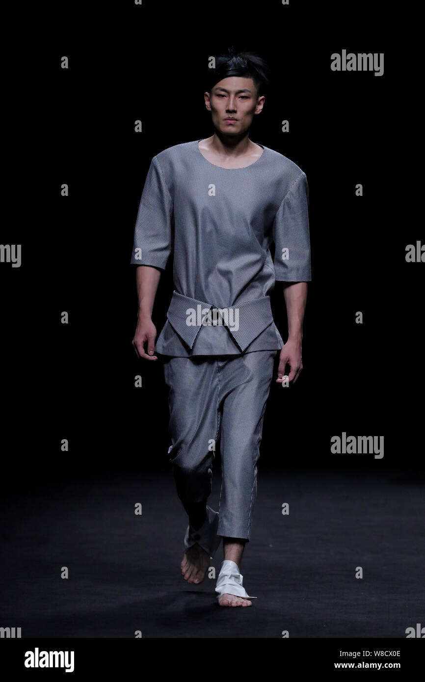 A model displays a new creation at the JUST FOR TEE X Pepsi fashion ...