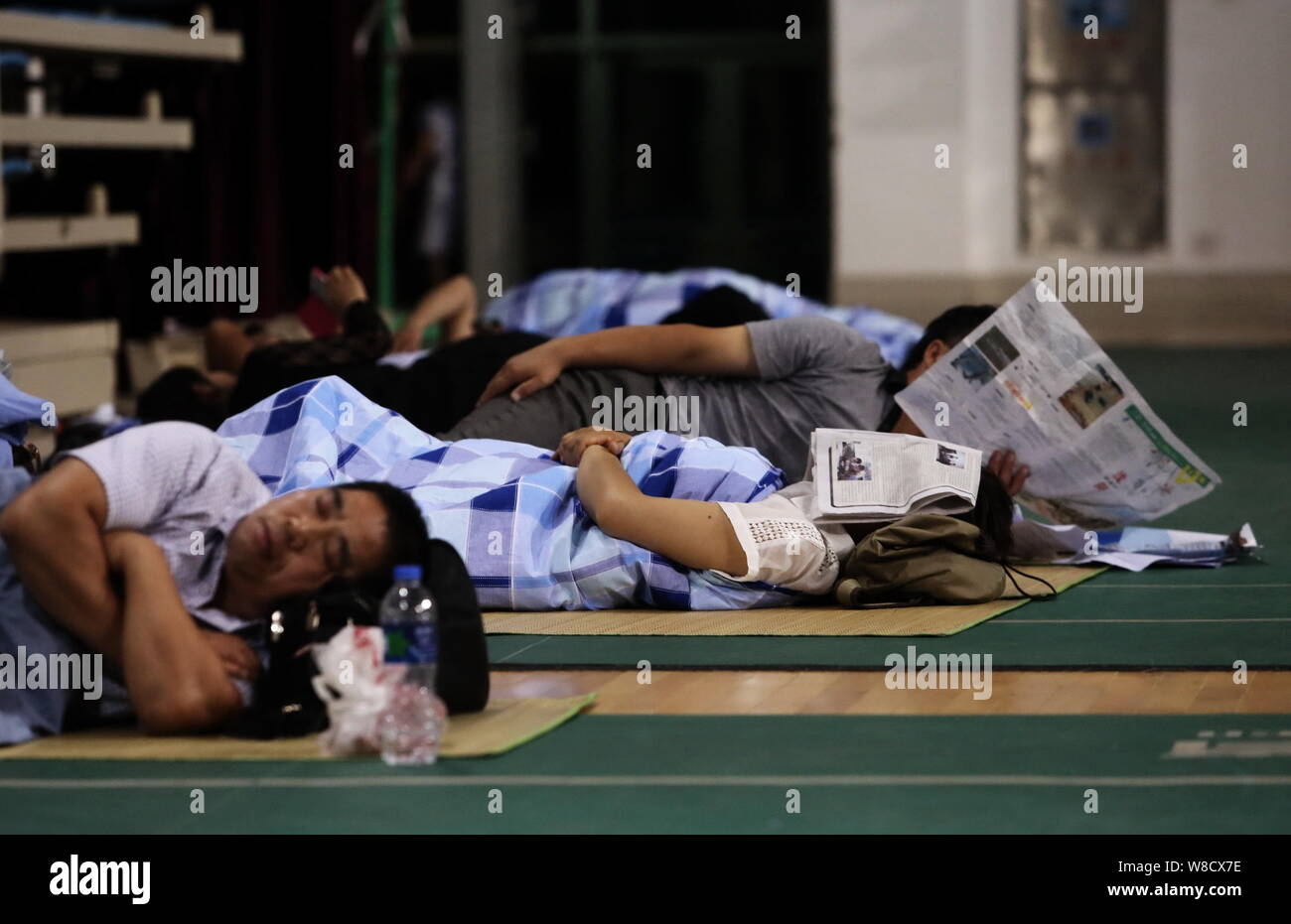 Children sleeping on floor mats hi-res stock photography and images - Alamy