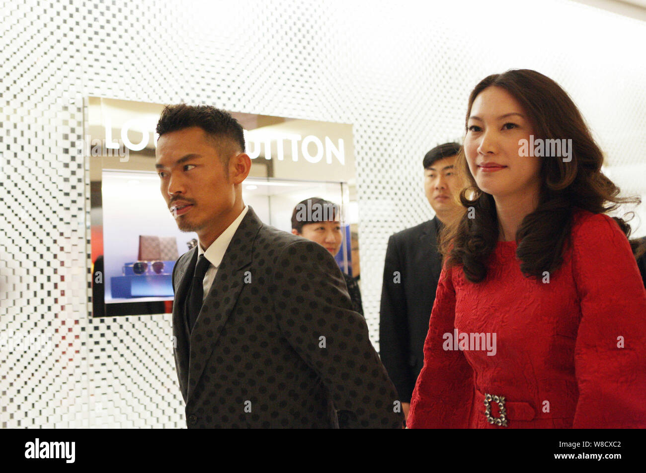 Chinese badminton star Lin Dan, left, and his wife Xie Xingfang attend ...