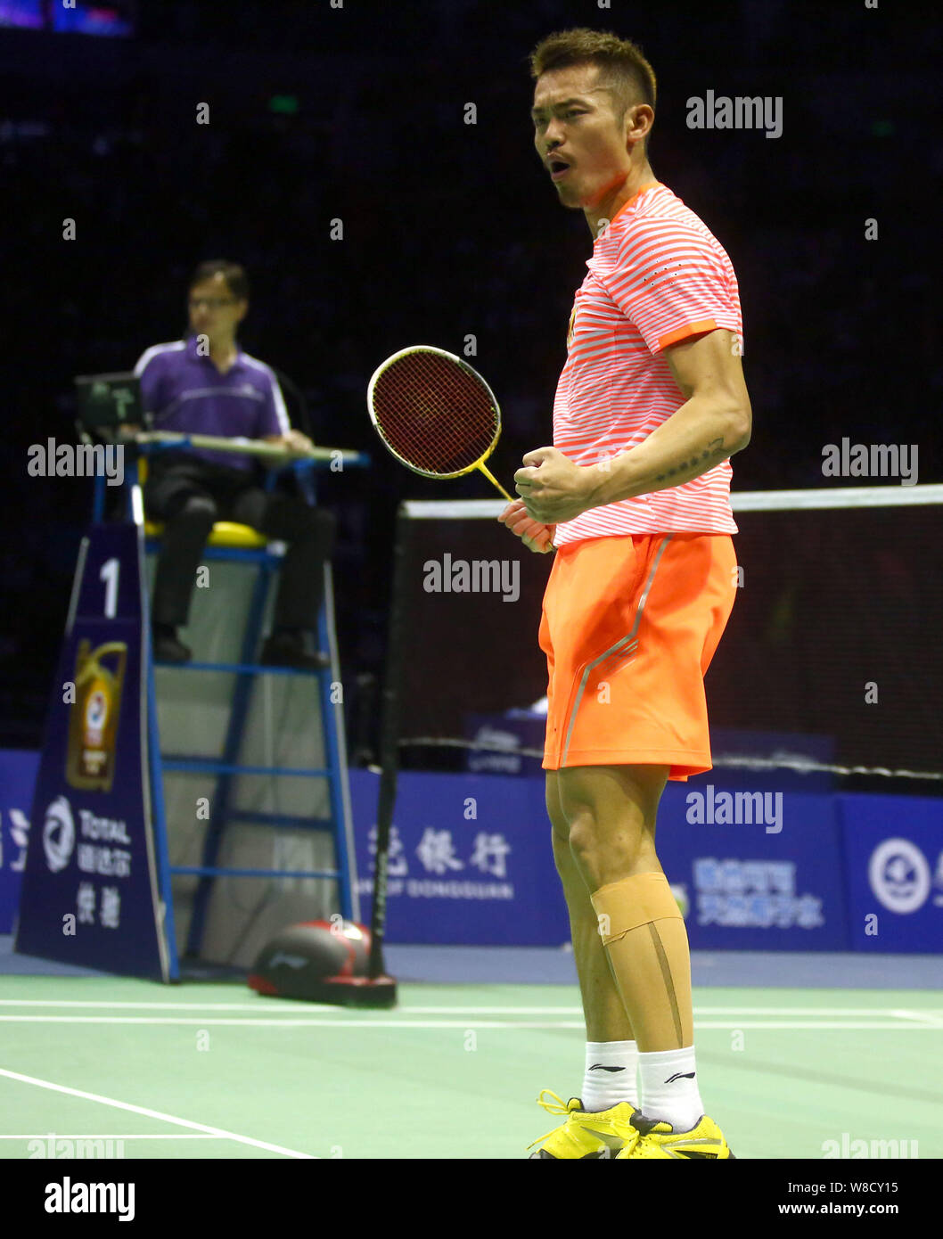 Lin Dan of China celebrates after scoring against Takuma Ueda of Japan ...
