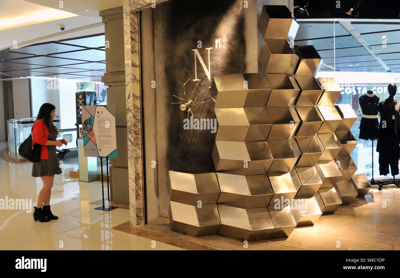 A visitor looks at the introduction of an art installation during a ...