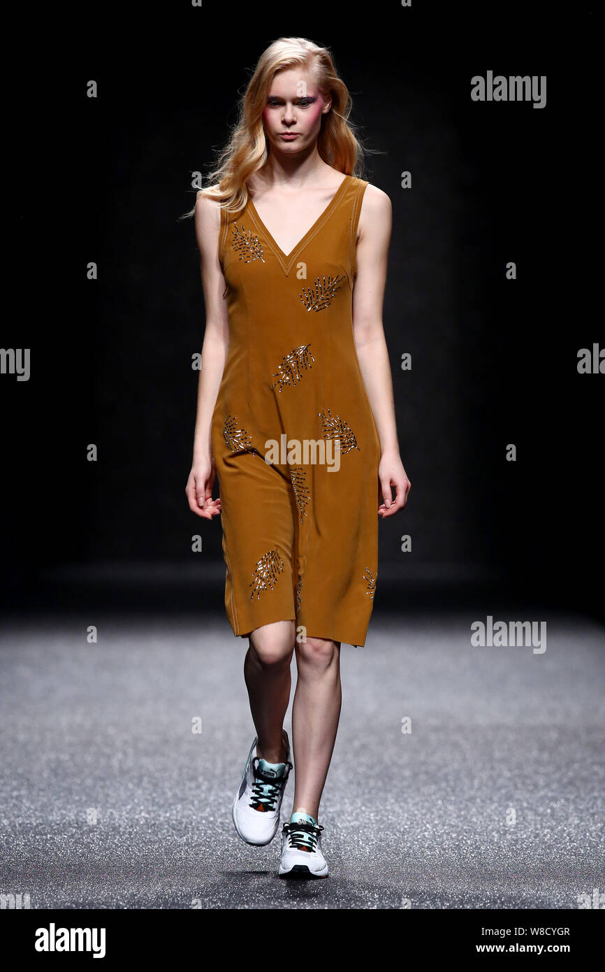 A model displays a new creation at the Nicole Zhang fashion show during ...