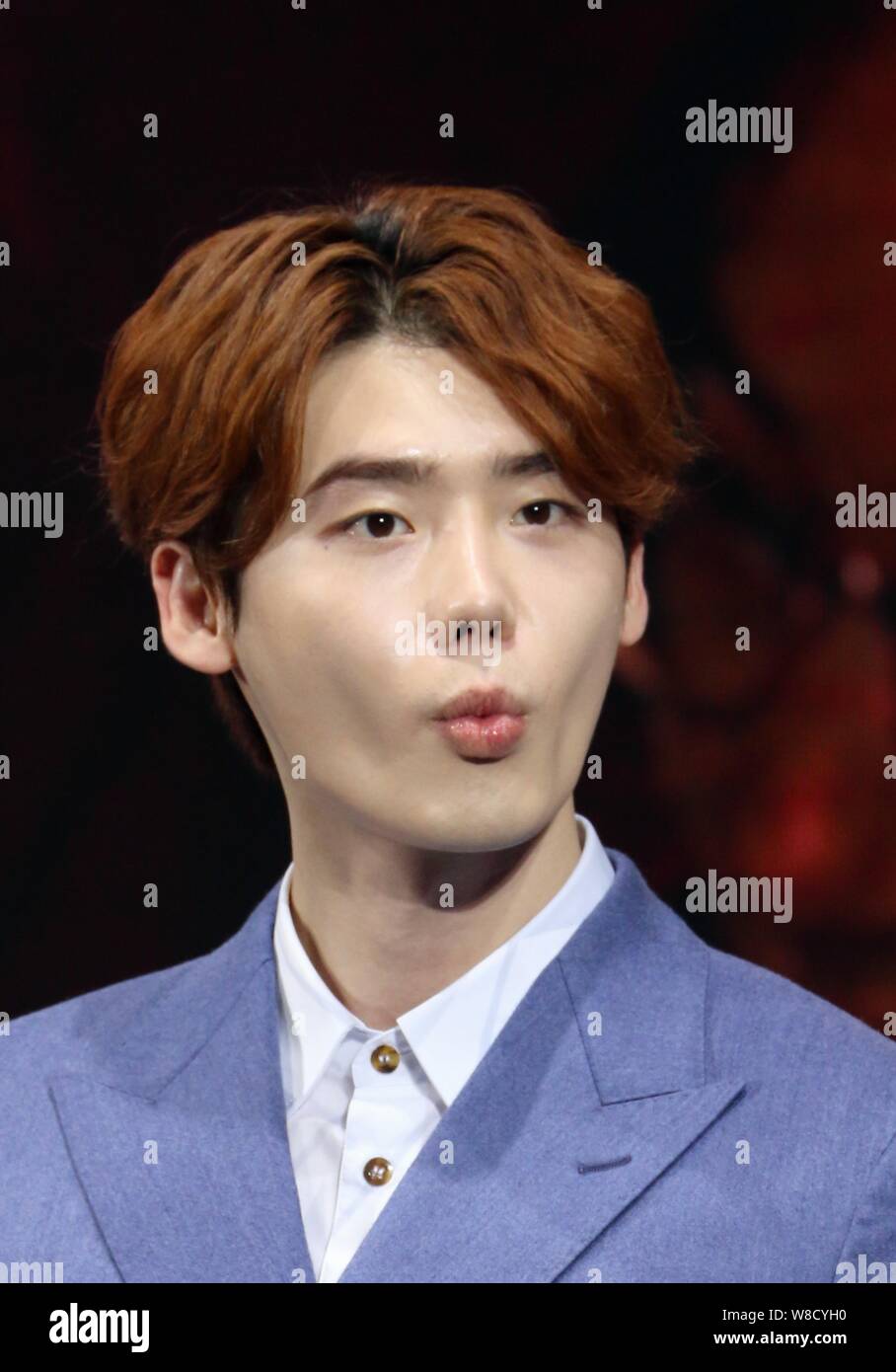 South Korean actor Lee Jong-suk makes faces during a promotional event ...