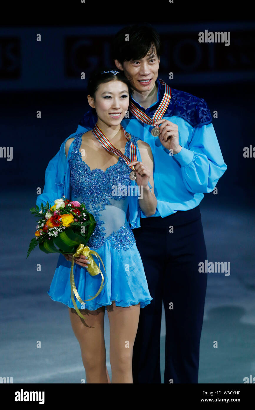Pang Qing and Tong Jian of China pose with their bronze medals during ...