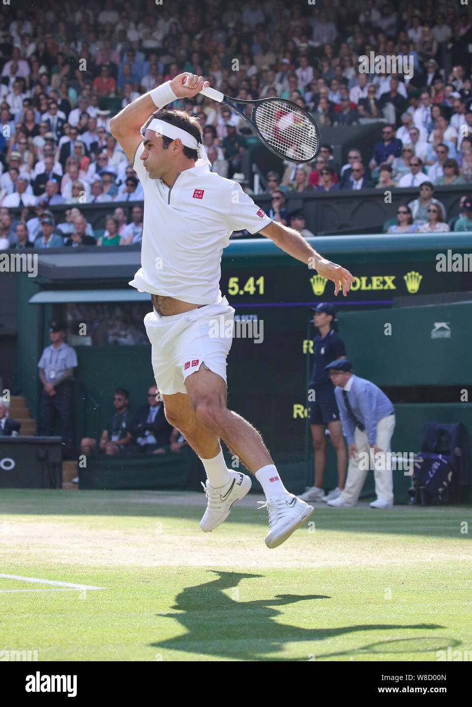 Low angle view of Swiss tennis player Roger Federer jumping in the air ...