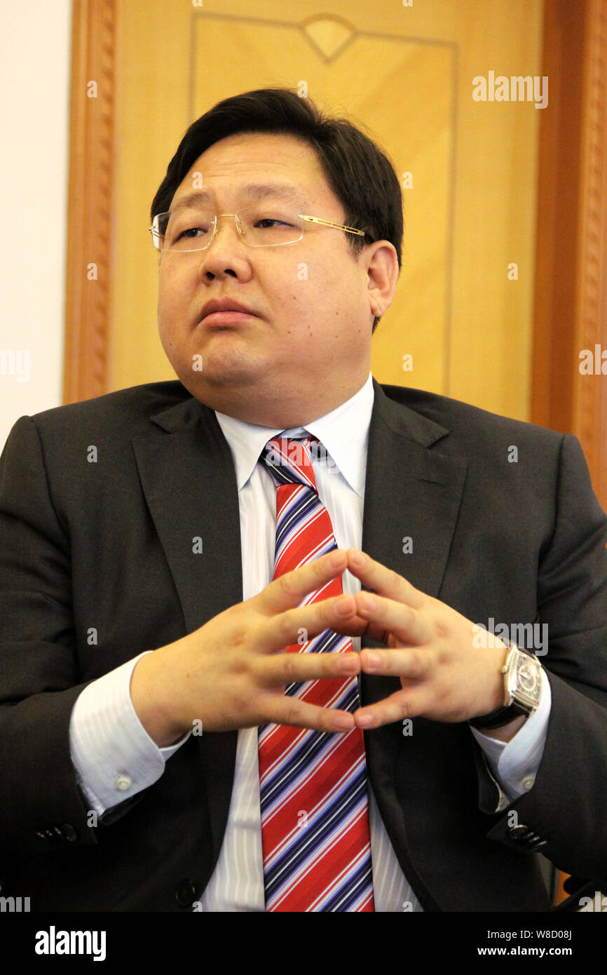 --FILE--Xu Ming, Chairman of Dalian Shide Group, reacts during an ...