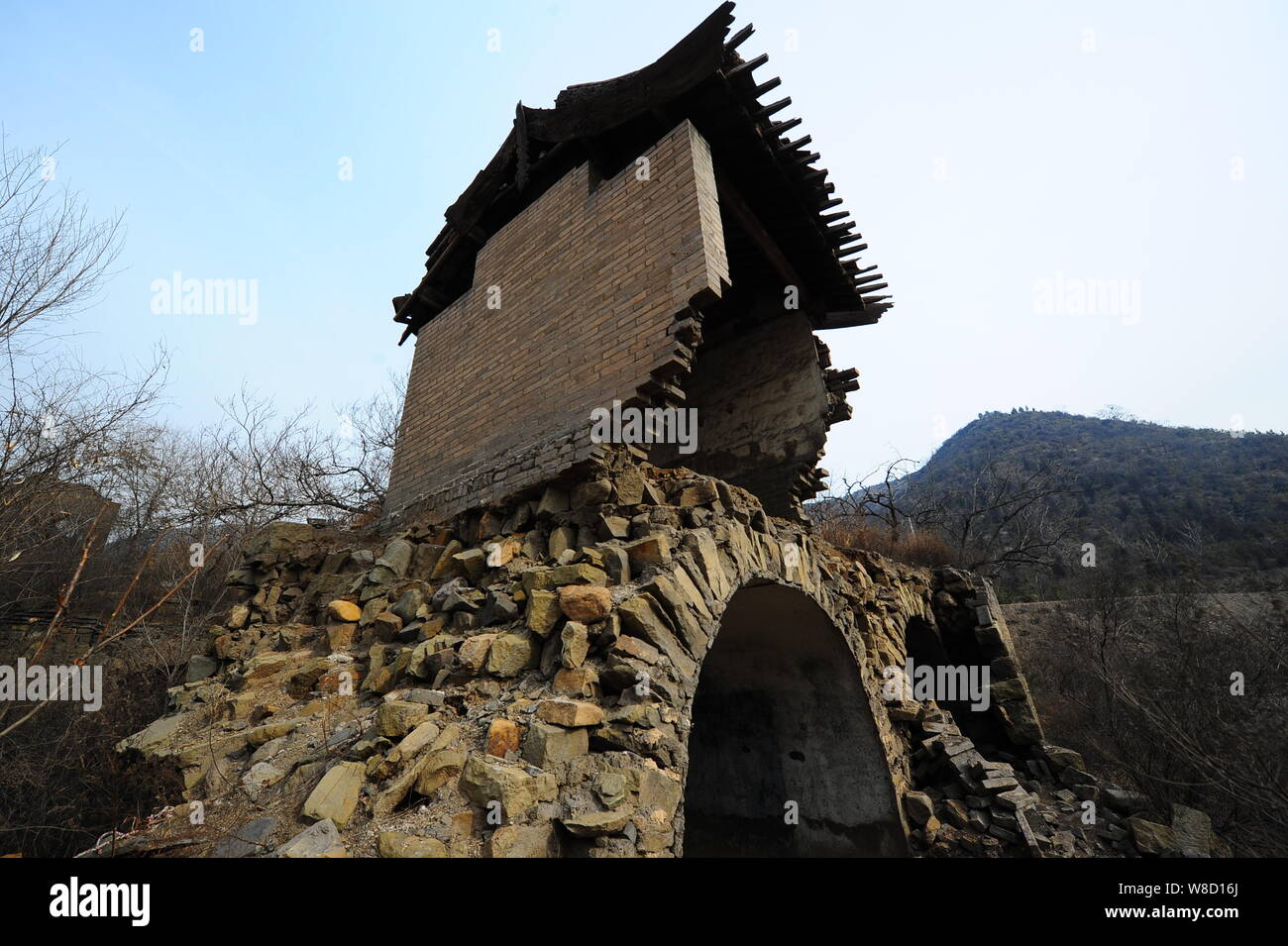 An old temple hangs half in the air after its foundation sank in ...
