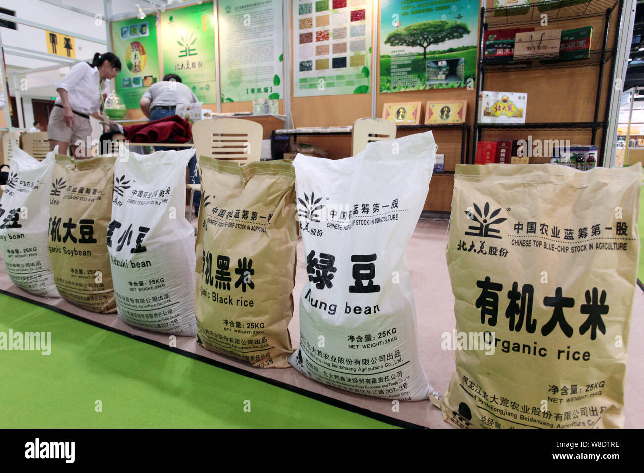 Sacks of organic rice and beans are on display at the stand of ...