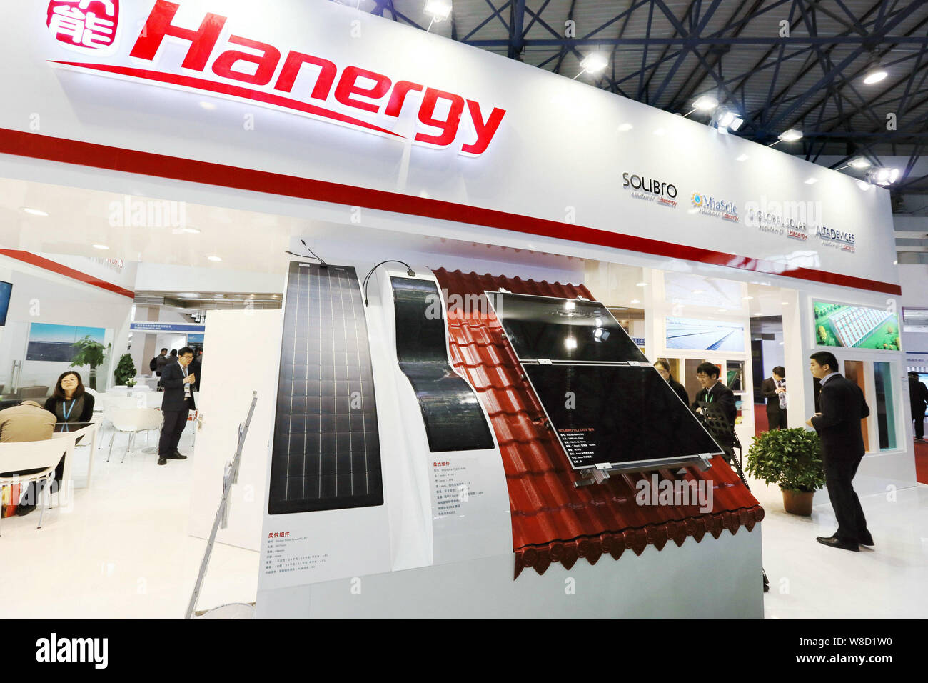 --FILE--People visit the stand of Hanergy during an exhibition in ...