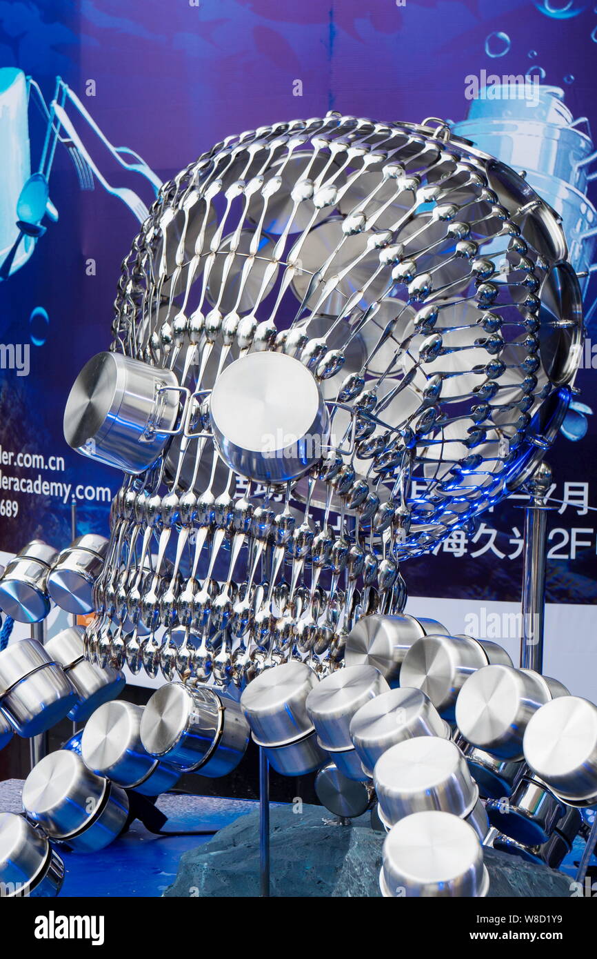 A giant octopus made out of cooking utensils is on display during a ...