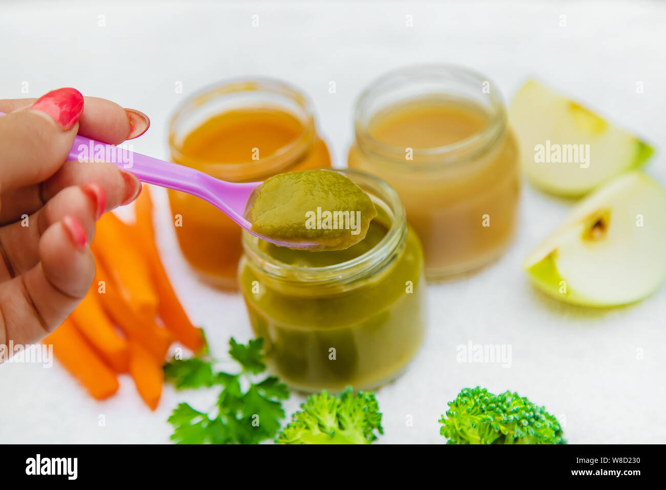 Baby food. Mashed vegetables and fruits in jars. Selective focus ...