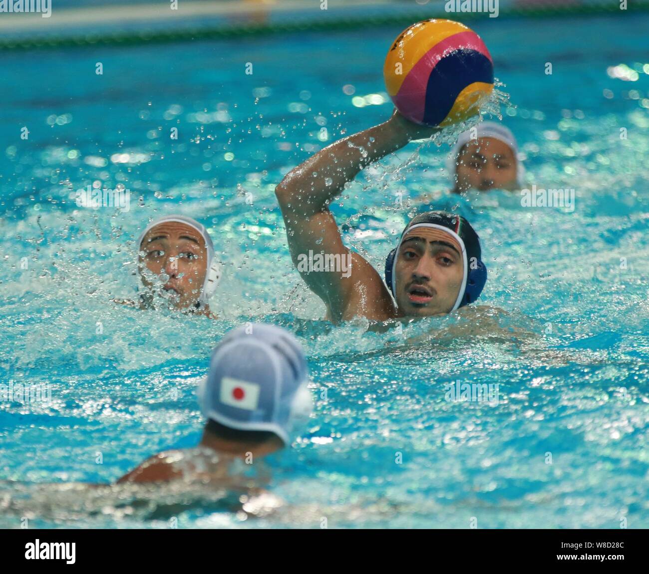 A player of Iran men's national water polo team competes against a ...