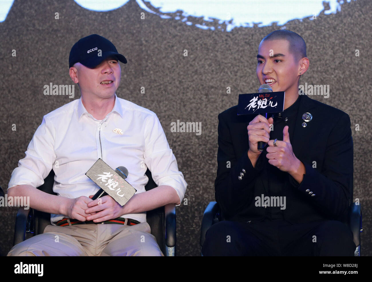Chinese actors Feng Xiaogang, left, and Wu Yifan attend a press ...