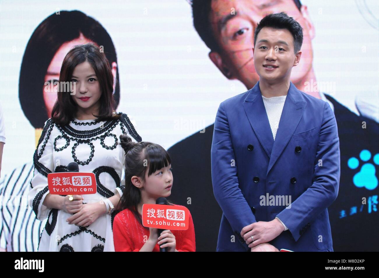 Chinese actress Zhao Wei, left, and actor Tong Dawei, right, pose ...