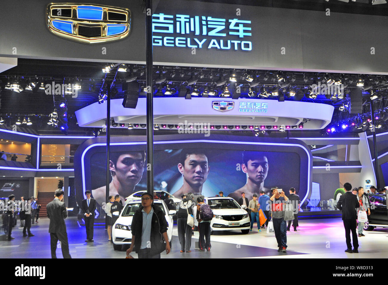 --FILE--People visit the stand of Geely Auto during the 16th Shanghai ...