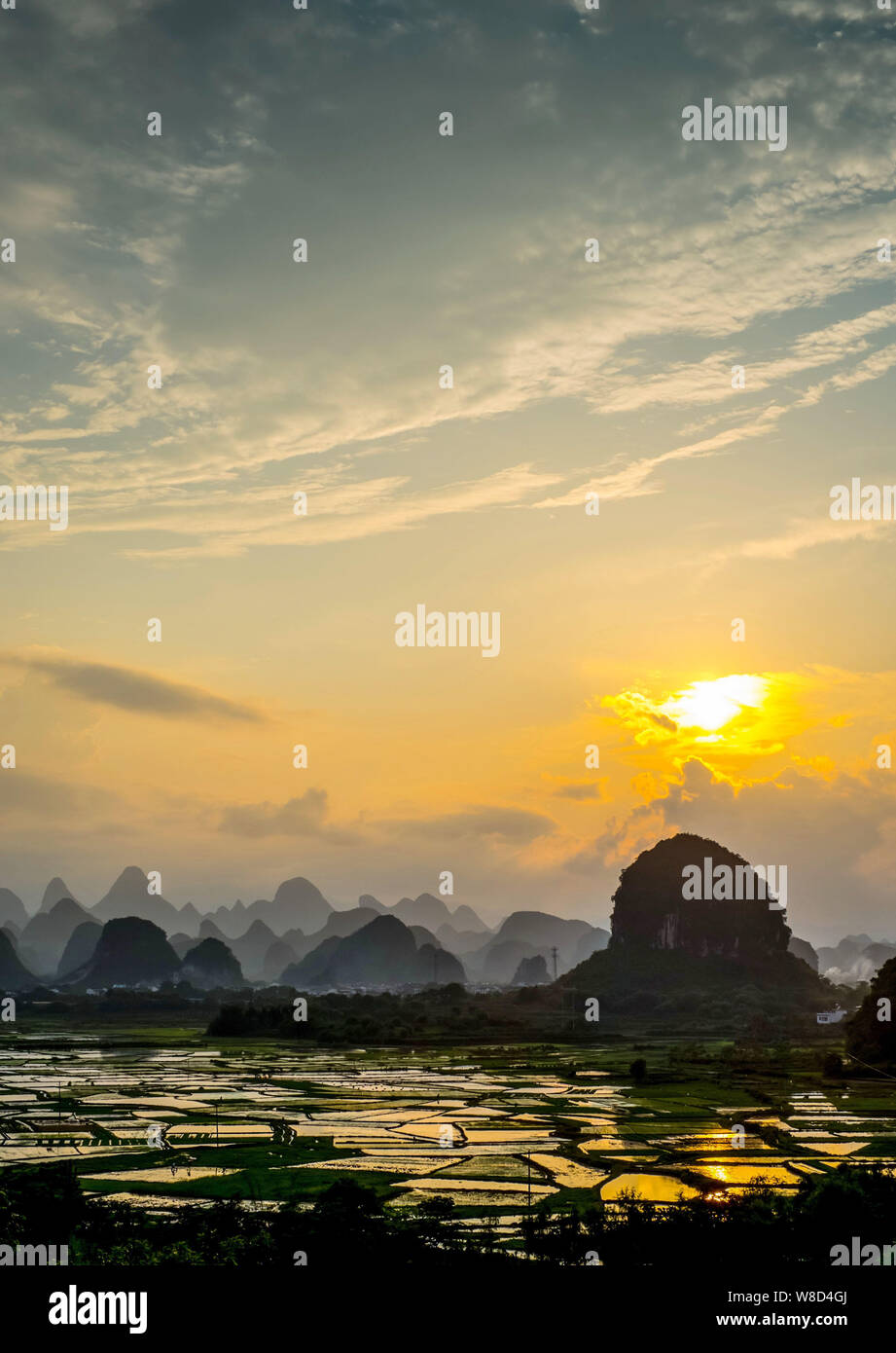 --FILE--Landscape of rice paddies surrounded by karst hills in Putao ...
