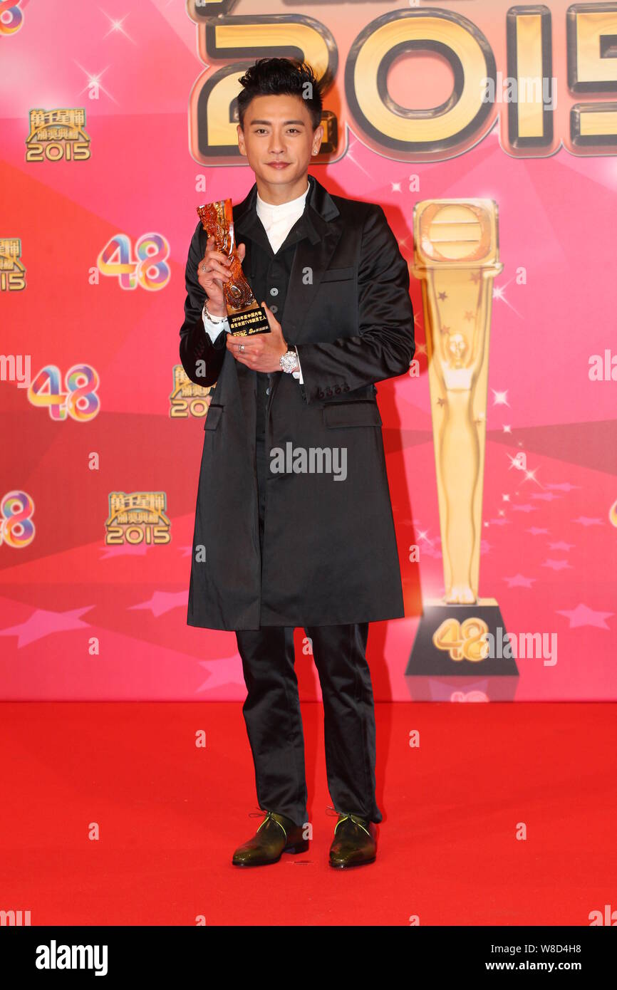 Hong Kong actor Bosco Wong poses with his trophy for the Mainland China ...