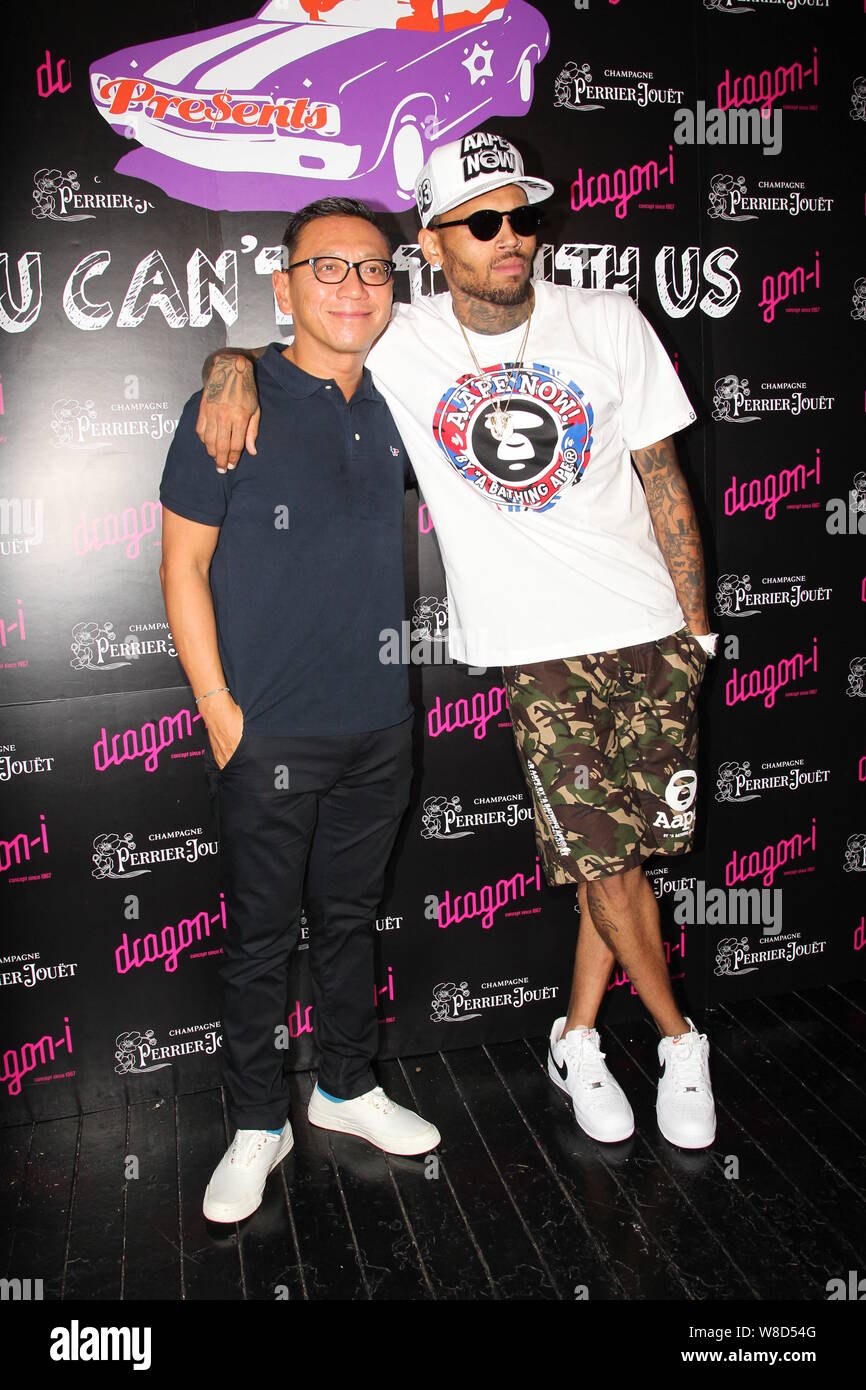 American singer and actor Chris Brown, right, poses with Gilbert Yeung ...