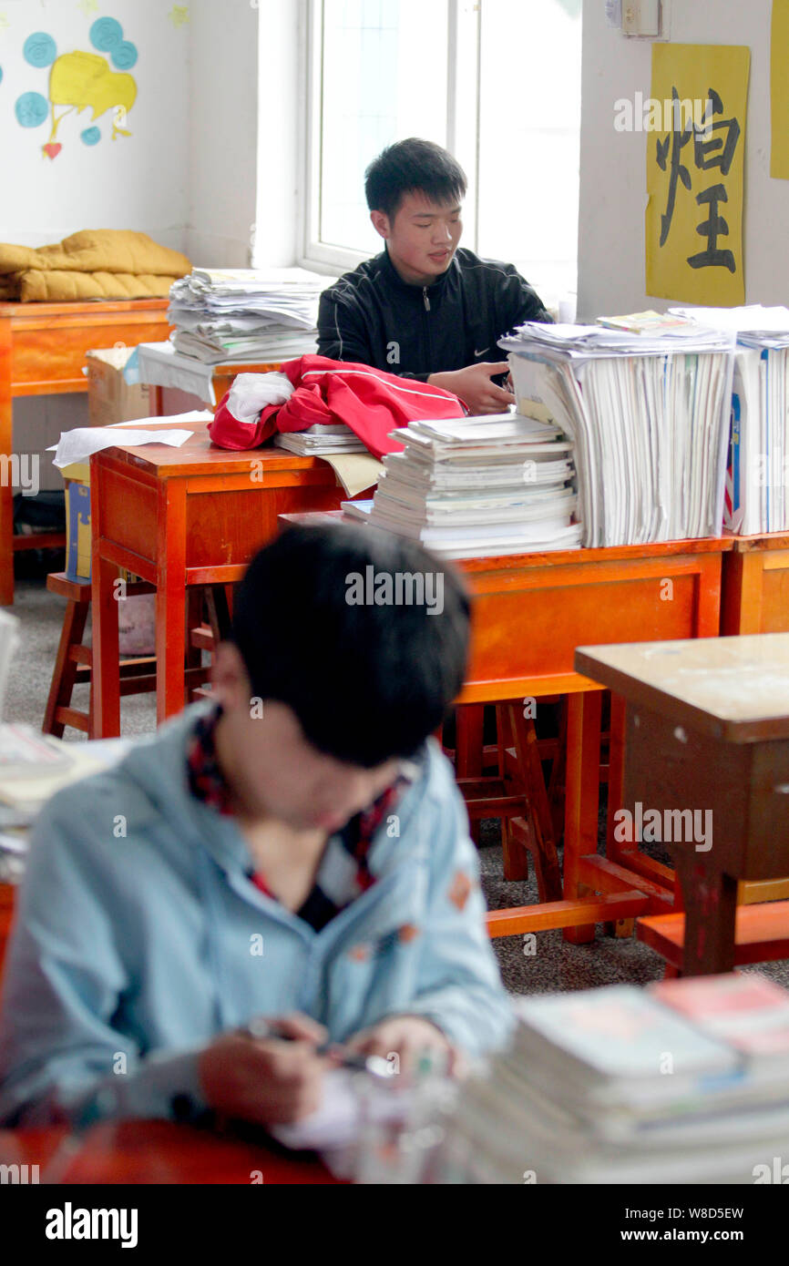 Chinese student Xie Xu, back, and his disabled classmate Zhang Chi ...