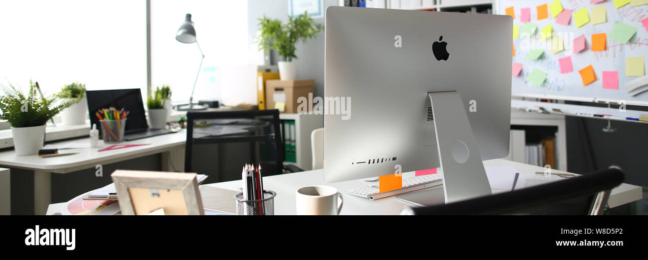 Apple imac computer aganist empty office Stock Photo - Alamy