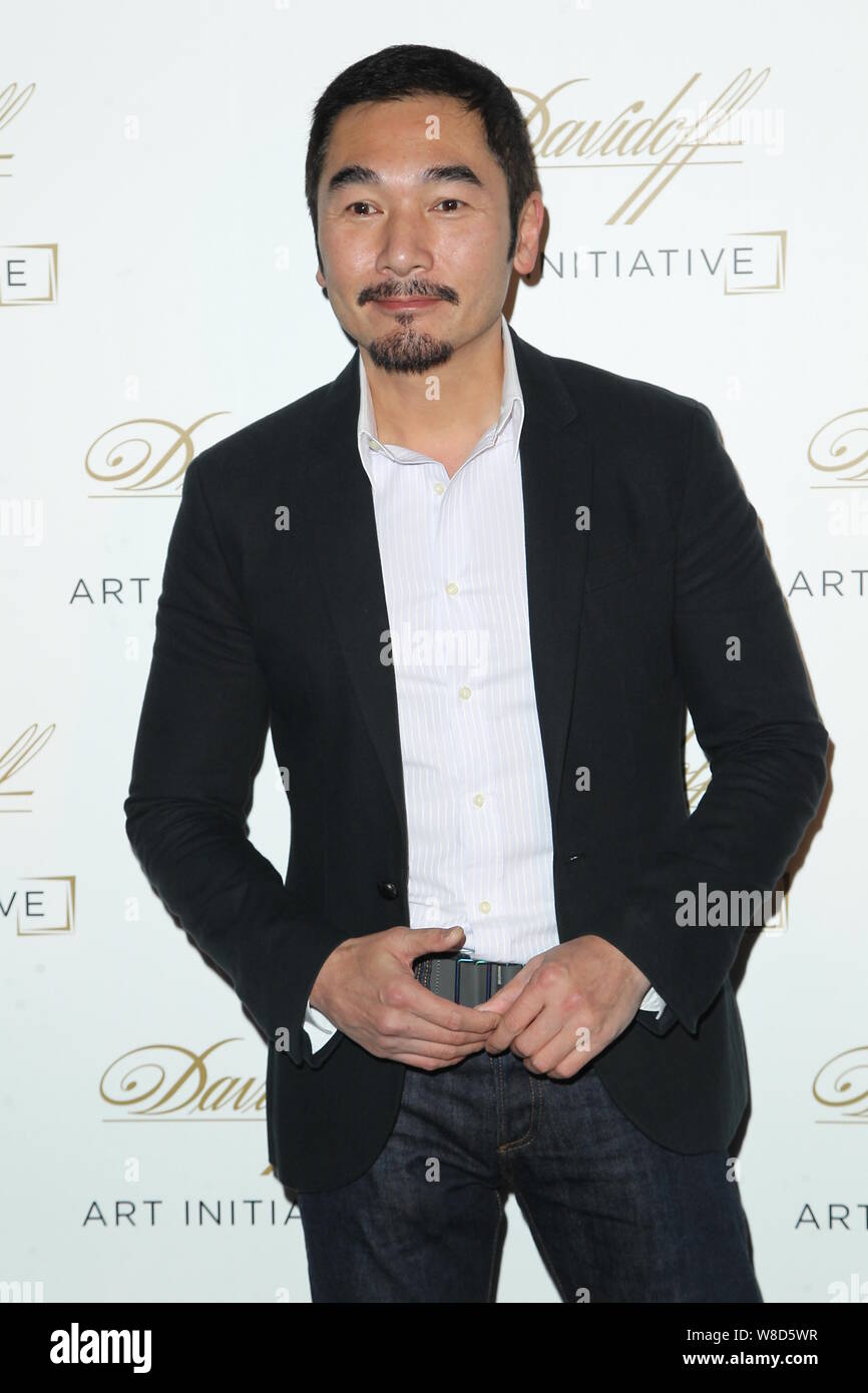 Hong Kong actor Alex Fong poses during a celebration party by Davidoff ...