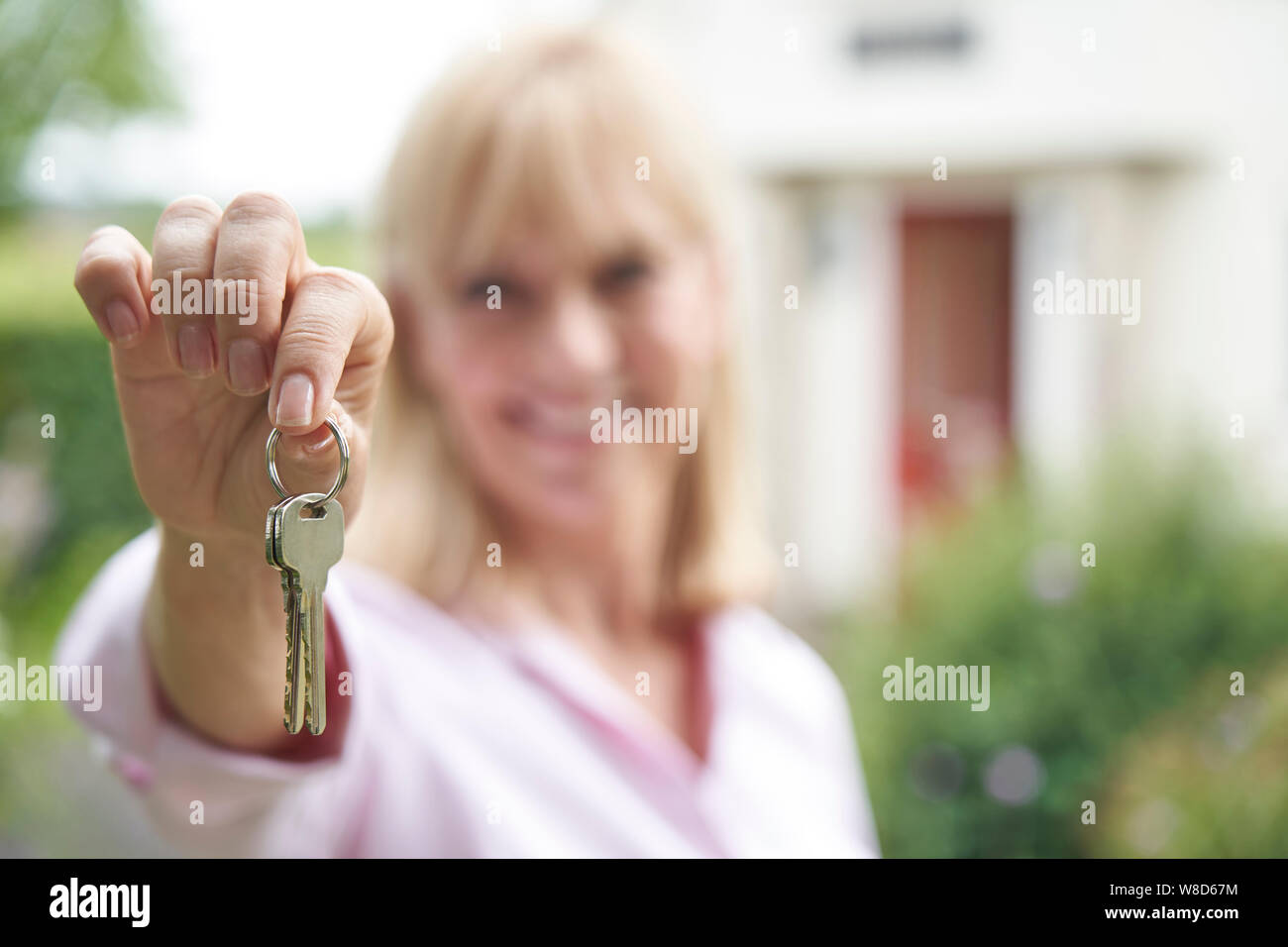 Woman keys home hi-res stock photography and images - Alamy