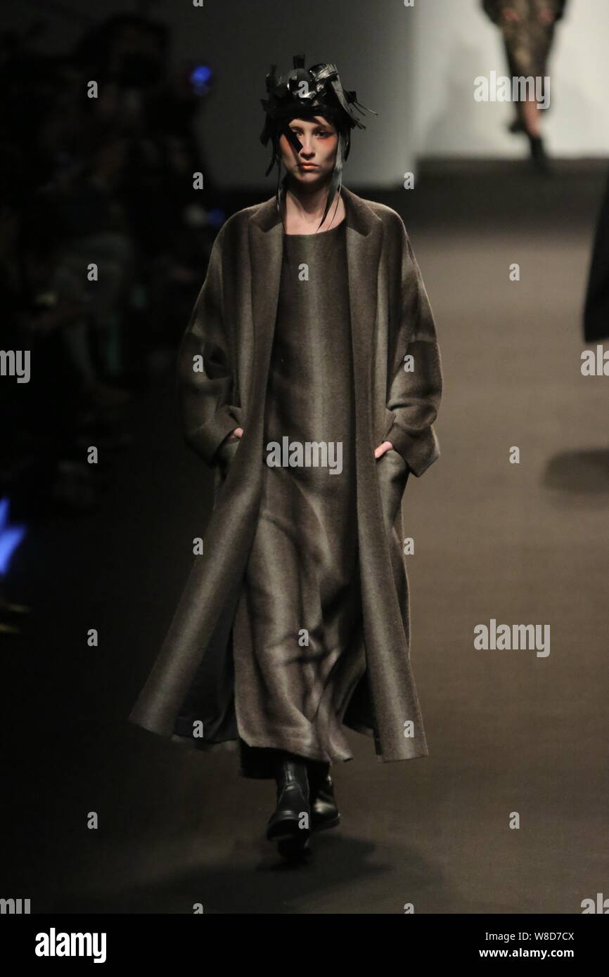 A model displays a new creation at the Zhang Yuhao fashion show during ...