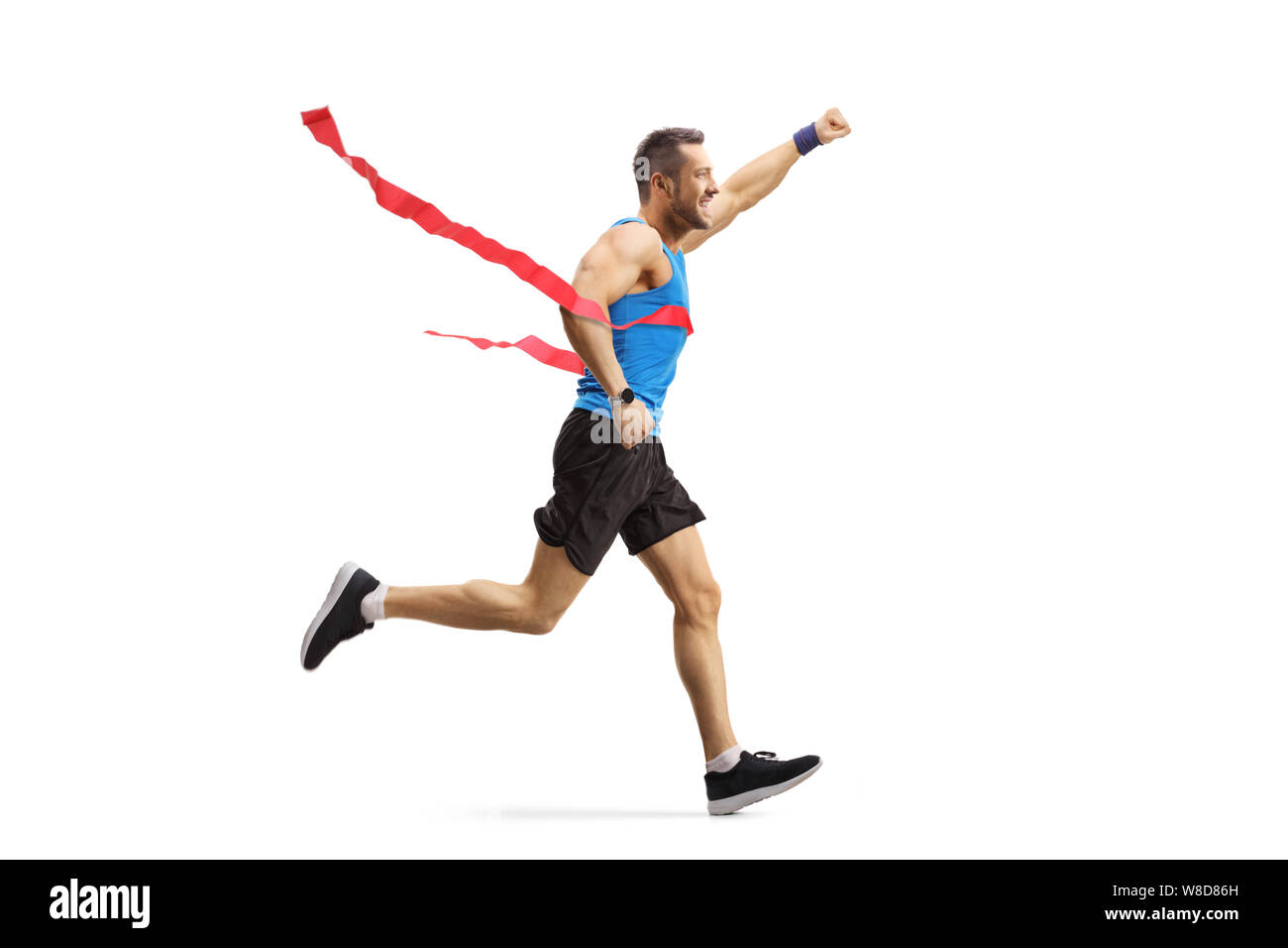 Full length shot of a male athlete on the finish line of a race ...