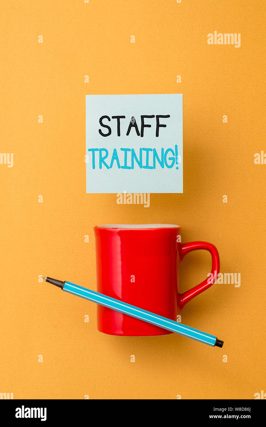 Writing note showing Staff Training. Business concept for learn ...