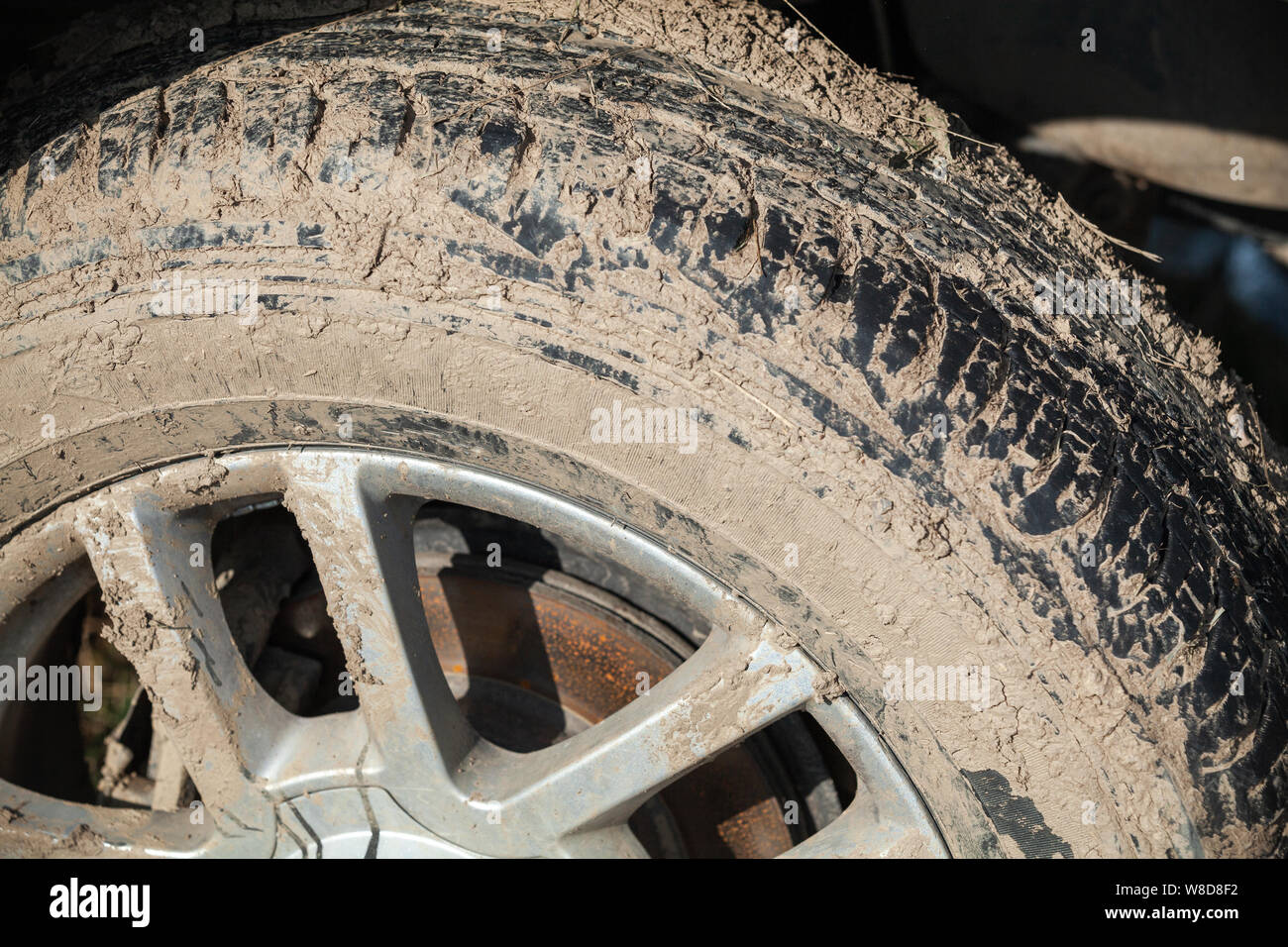 Dirty 4x4 SUV car wheel with light alloy disc, closeup photo, off-road ...